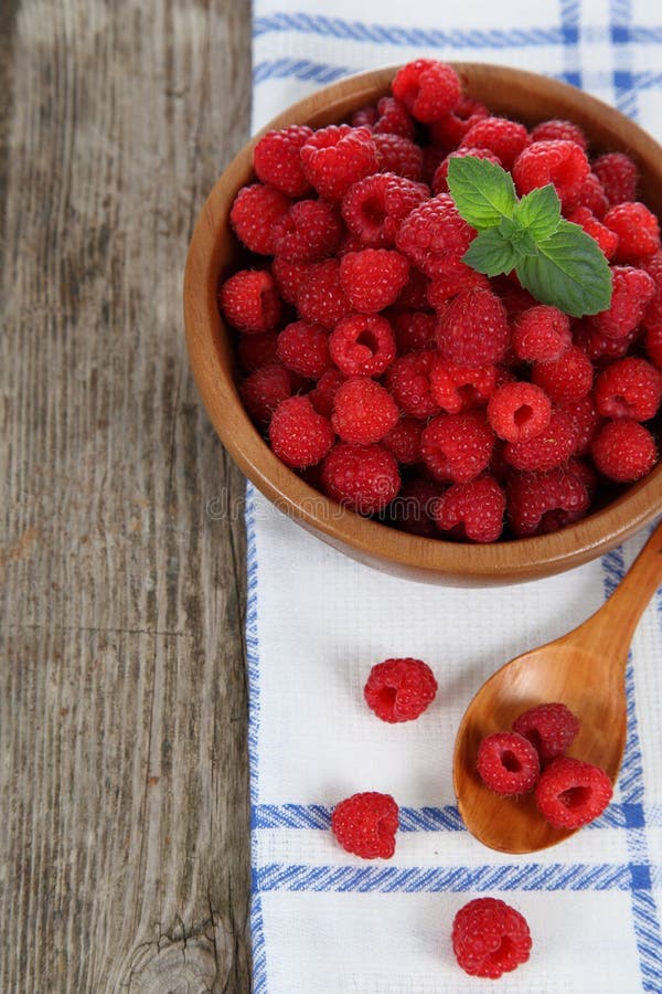 Ripe raspberries in a bowl stock photo. Image of berry - 63261268