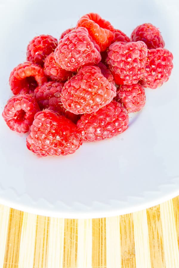 Ripe Raspberries on Plate stock image. Image of mushy - 47258145