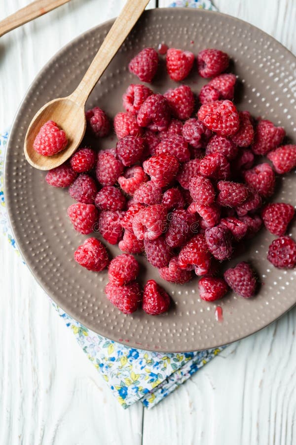 Ripe Raspberries on a Plate Stock Photo - Image of white, beautiful ...