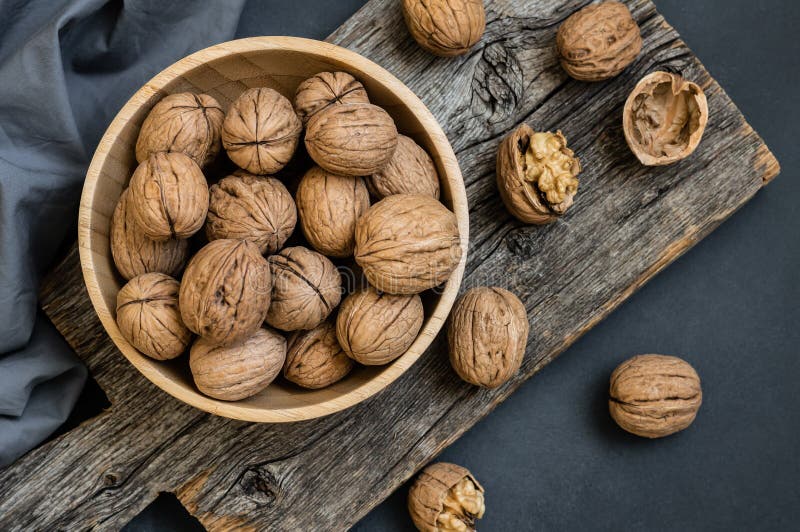Ripe and Raw Whole Big Walnut Kernel with Shell on Rustic Backdrop ...