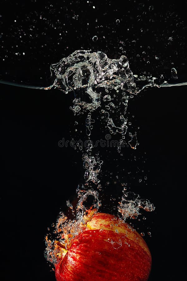 Red Apple Falling Into The Water With A Splash Stock Photo - Image of ...