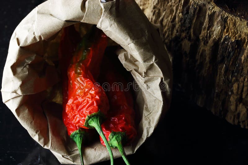 RIPE RED CHILIS in a BROWN PAPER PACKET Stock Photo - Image of back ...