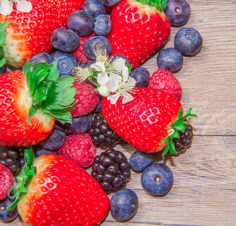 Ripe Red Fruits on Wooden Table Stock Image - Image of wooden, wood ...