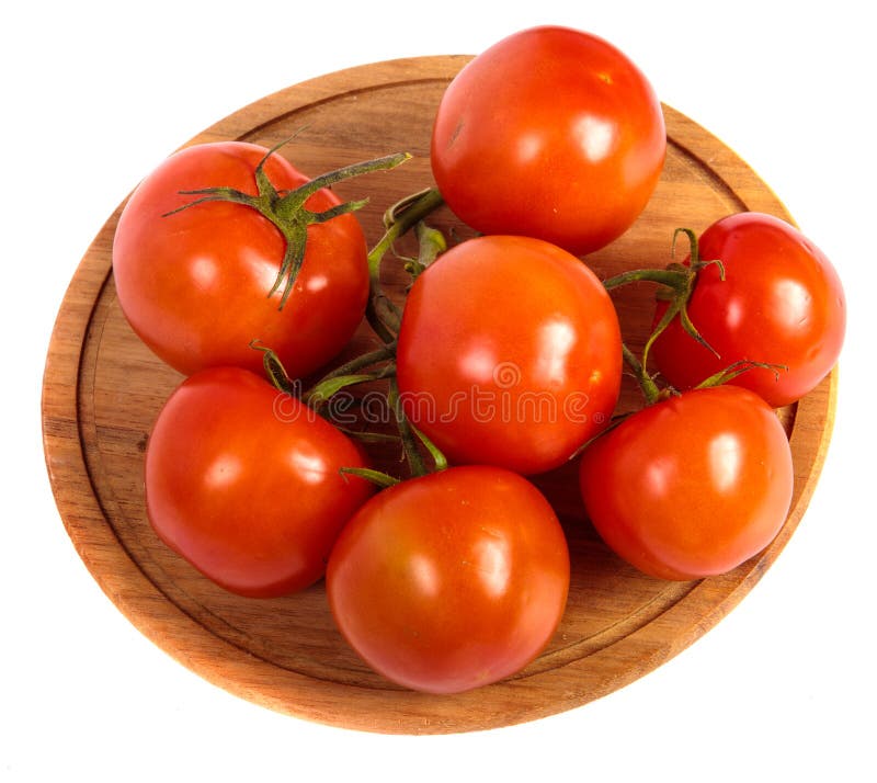 Ripe Red Tomatoes on a Round Wooden Cutting Board. White Stock Photo ...