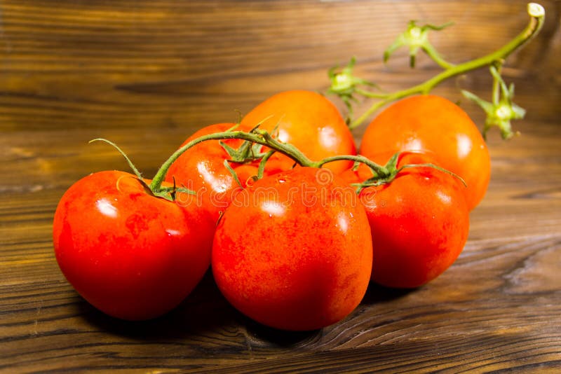 Ripe Red Tomatoes on Wooden Table Stock Photo - Image of natural ...
