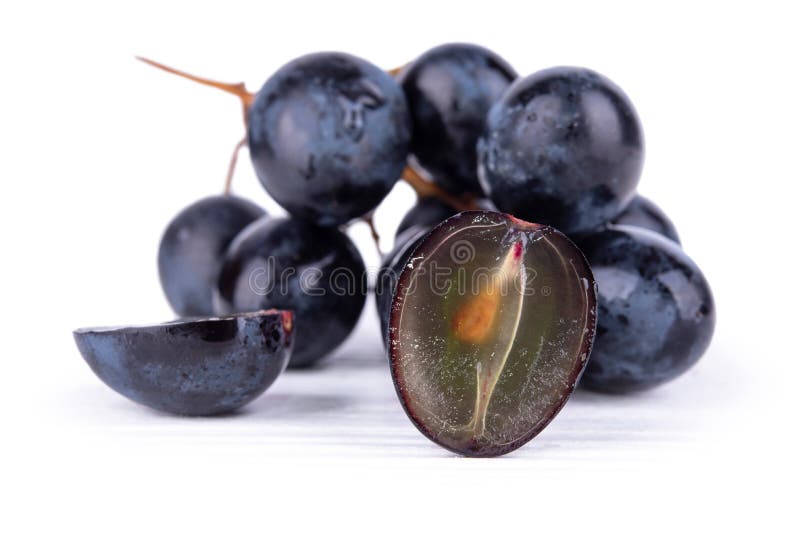 Sliced Dark Grapes on White Surface Close-up Stock Photo - Image of ...