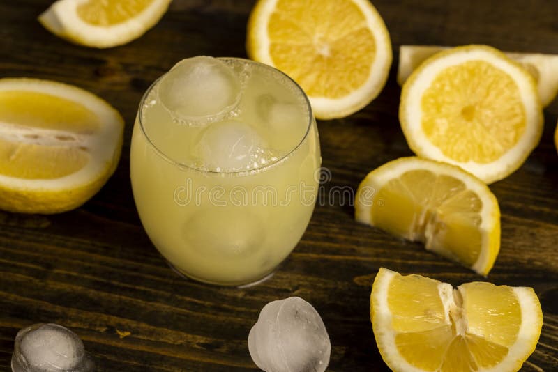Ripe Sliced Lemon and Cold Juice with Ice and Their Reflection on a Wet ...