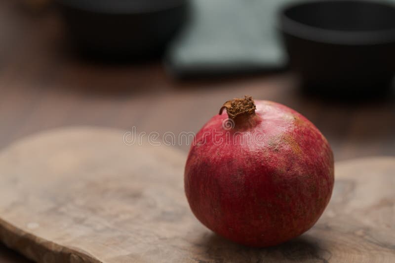 Ripe Small Pomegrenate on Olive Wood Board Stock Image - Image of olive ...