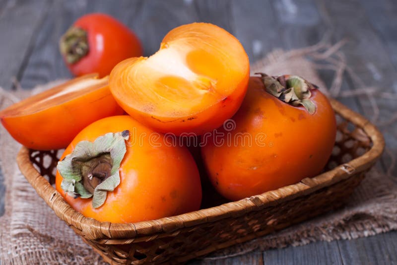 Ripe Sweet Persimmons, on Wooden Table Stock Photo - Image of persimmon ...