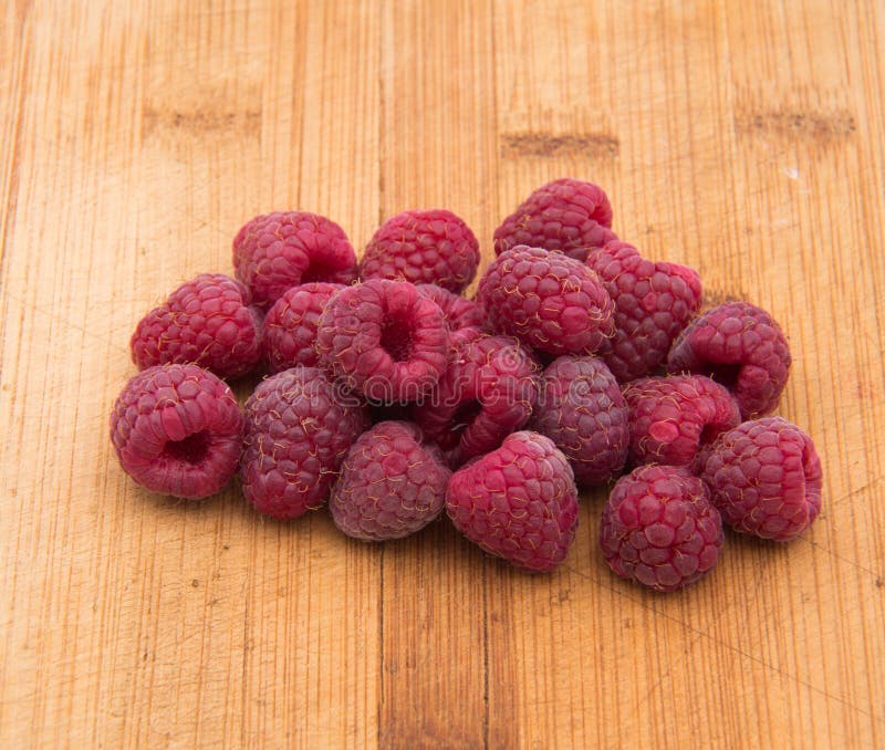 Ripe Sweet Raspberries on Wood Table Close-up Stock Image - Image of ...