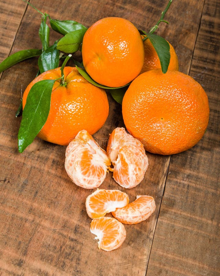 Ripe Tangelos with Leaves and Sections Stock Photo - Image of foods ...