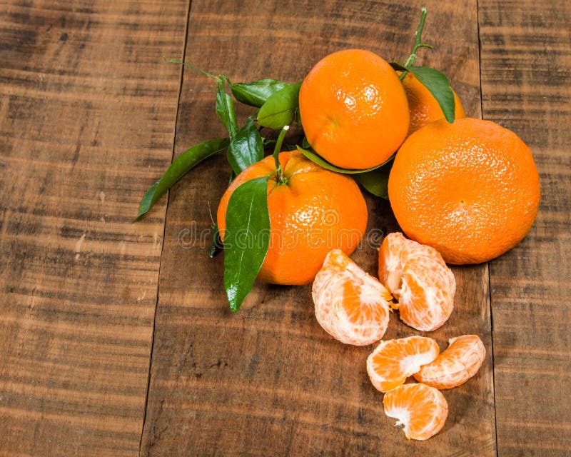Ripe Tangelos with Leaves and Sections Stock Photo - Image of sectioned ...