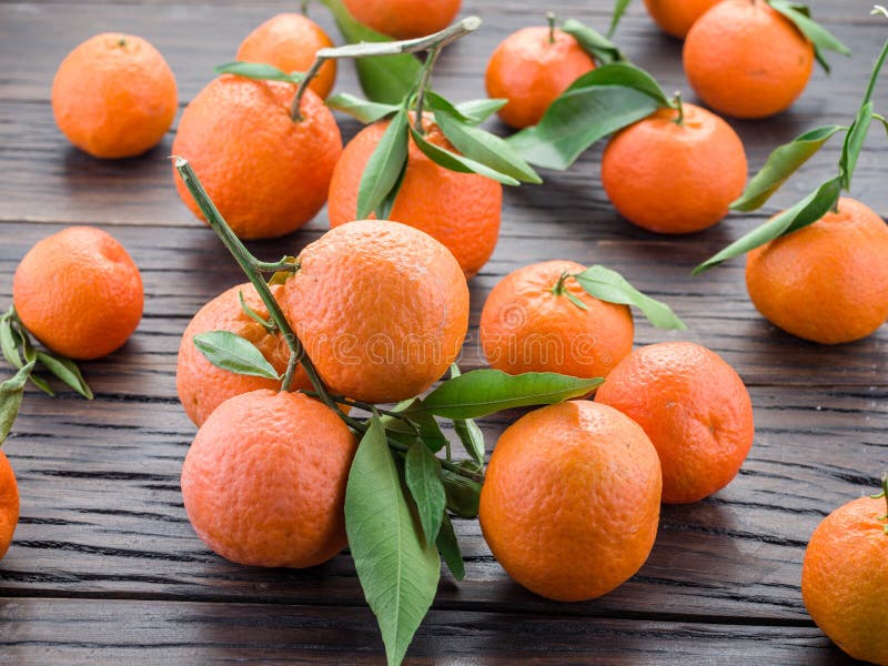 Ripe Tangerines with Leaves on Rustic Table with Cloth Stock Photo ...