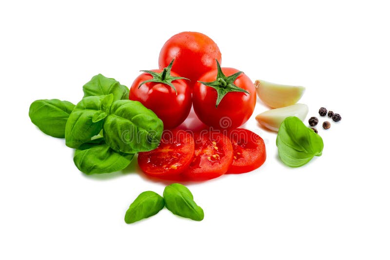 Ripe Tomato Cut into Slices Along with Basil and Garlic on a White ...