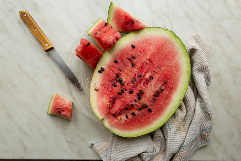 Ripe Watermelon Cut into Slices on a Light Table by Window, Still Life ...