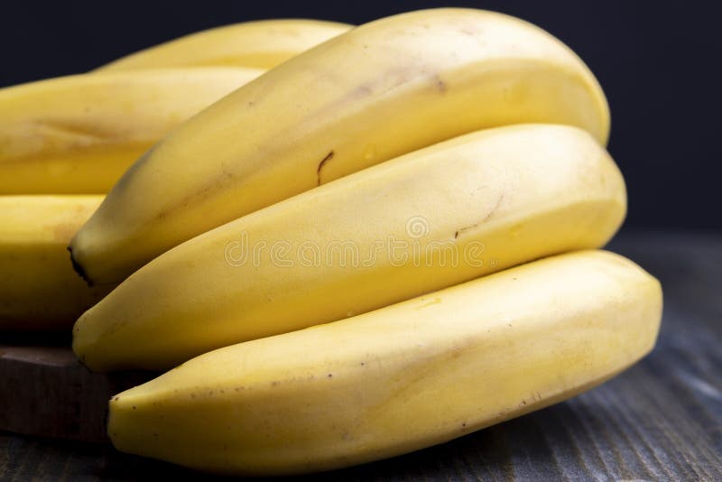 Ripe Yellow Bananas on the Table Stock Photo - Image of branch, yellow ...