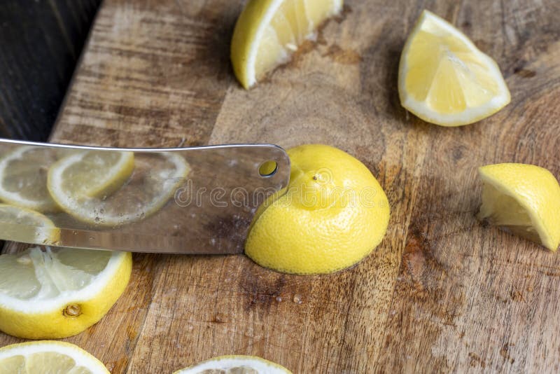 Ripe Yellow Lemon Cut into Pieces Stock Photo - Image of cooking, wood ...