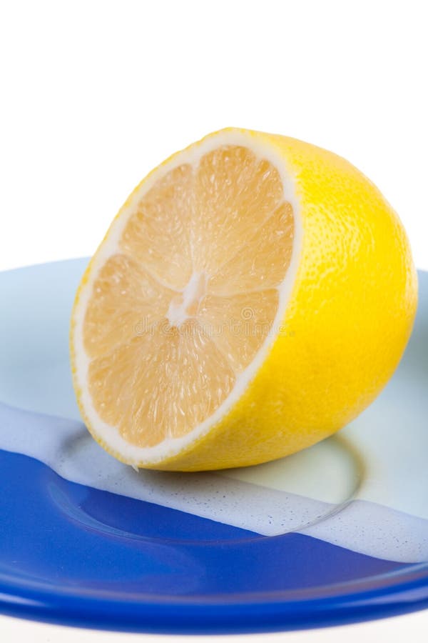 Ripe Yellow Lemon on Dark Blue Saucer Stock Image - Image of dark ...
