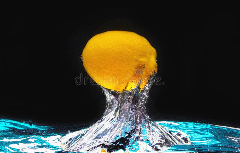 A Ripe Yellow Lemon Flies Out of the Water with a Splash Stock Image ...