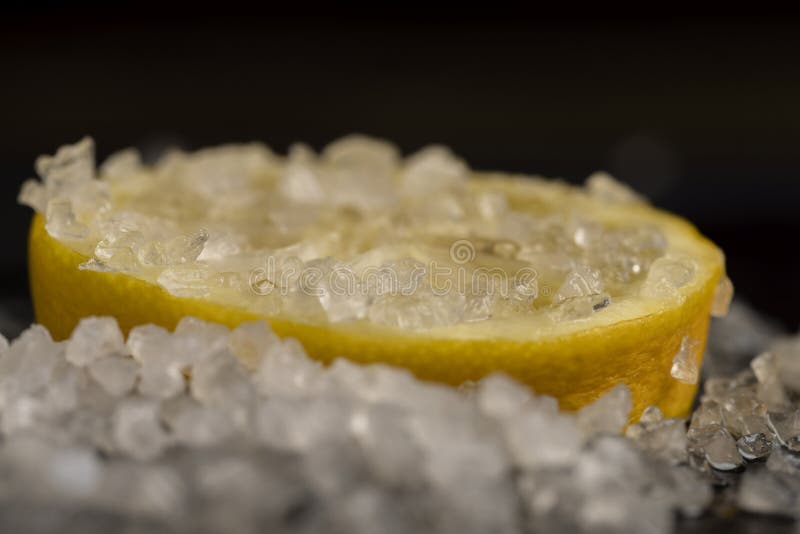 Ripe Yellow Lemon and Salt on a Black Board Stock Photo - Image of ...