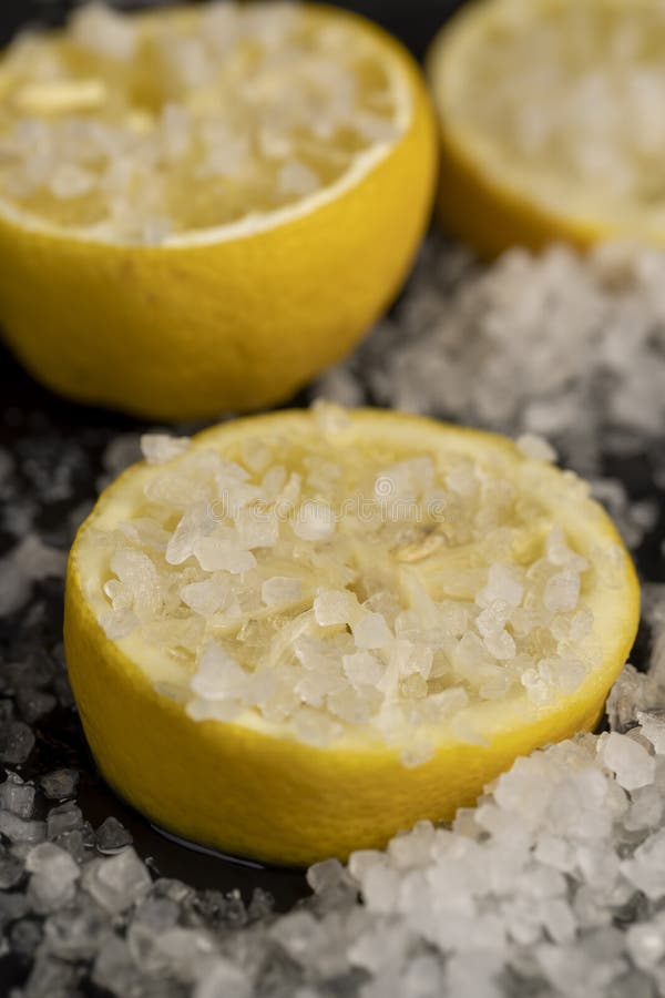 Ripe Yellow Lemon and Salt on a Black Board Stock Photo - Image of ...