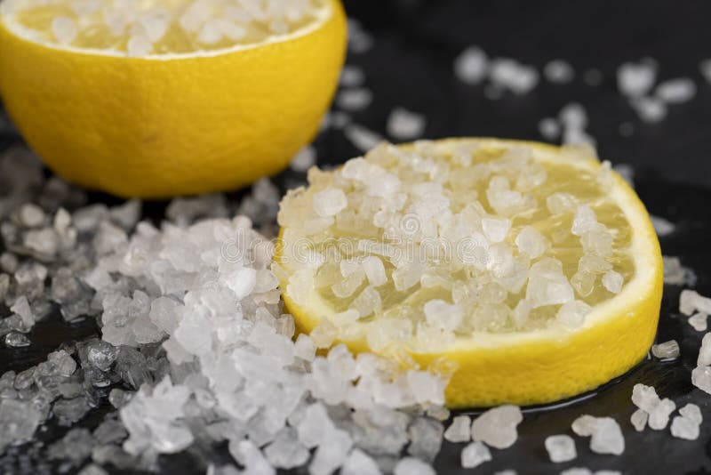 Ripe Yellow Lemon and Salt on a Black Board Stock Image - Image of ...