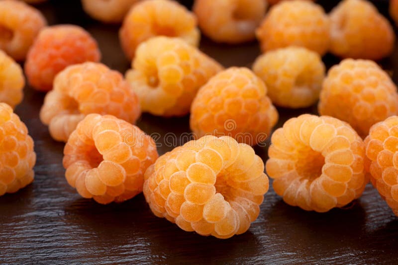 Yellow Raspberry Berries on Black Stock Photo - Image of closeup ...