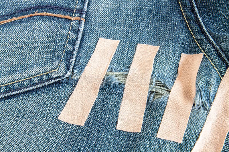 Ripped Blue Jeans at the Back Stock Image - Image of fashion, patched ...