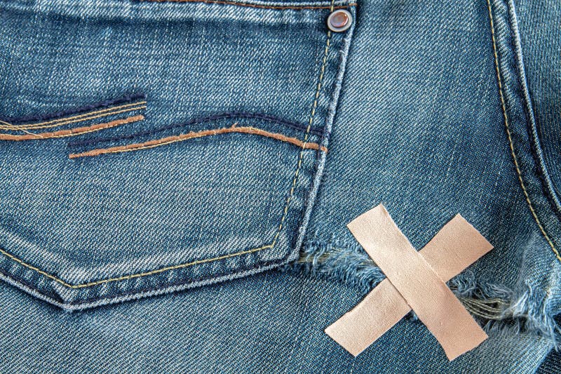 Ripped Blue Jeans at the Back Stock Photo - Image of clothing, patch ...
