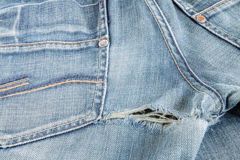 Ripped Blue Jeans at the Back Stock Photo - Image of closeup, blue ...