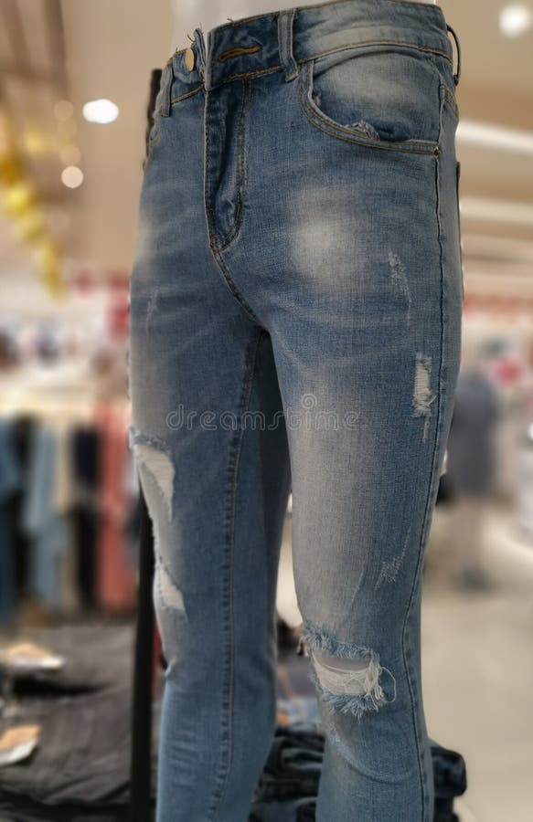 Ripped Denim Pants at Fashion Store Stock Image - Image of store, pants ...