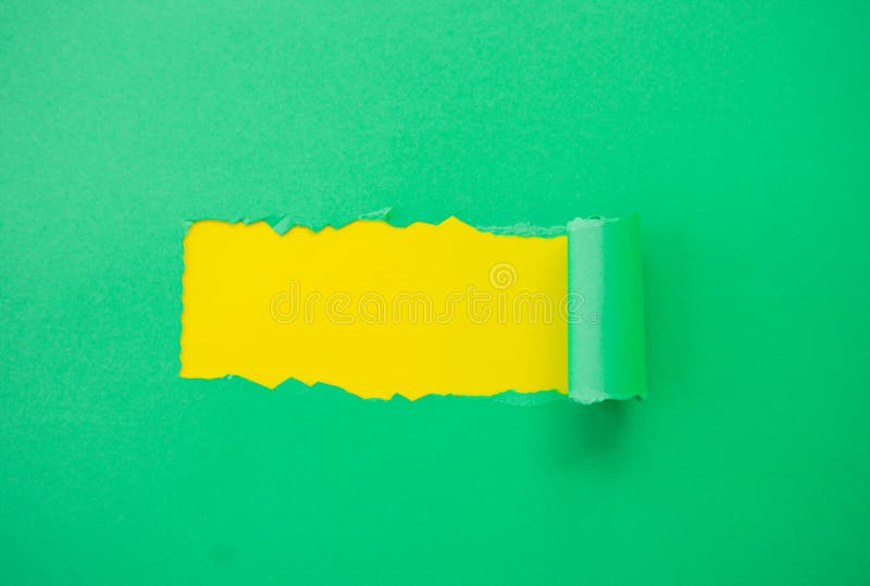 Ripped Green Paper Against a Yellow Background Stock Image - Image of ...