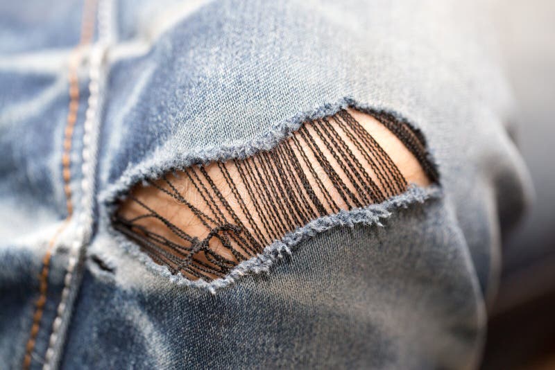 Ripped jeans at the knee stock image. Image of copy, blank - 88853357