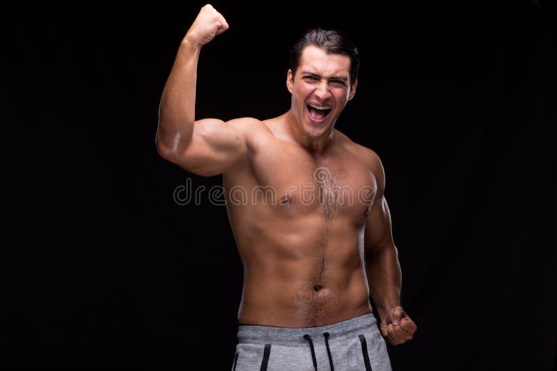 The Ripped Muscular Man on Black Background Stock Image - Image of ...