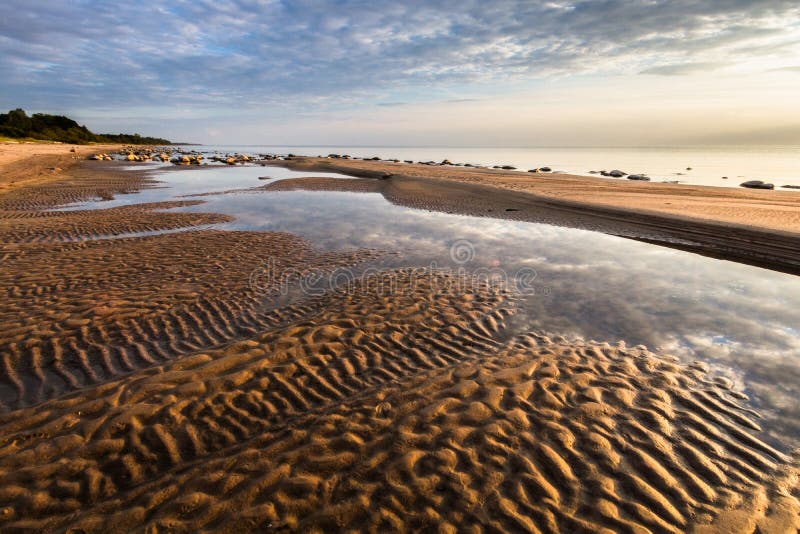 Ripped sand beaches stock image. Image of sand, reflection - 65403519