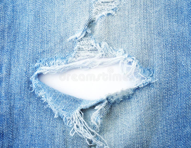 Ripped Torn Pattern of Light Blue Jeans Stock Photo - Image of closeup ...