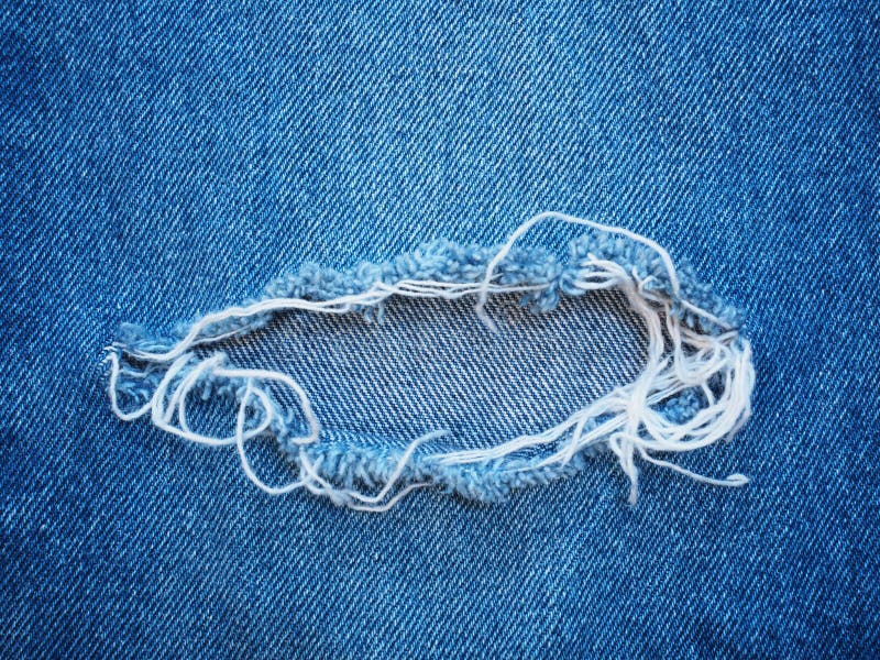 Ripped Torn Pattern of Blue Denim Jeans Texture and Background Stock ...