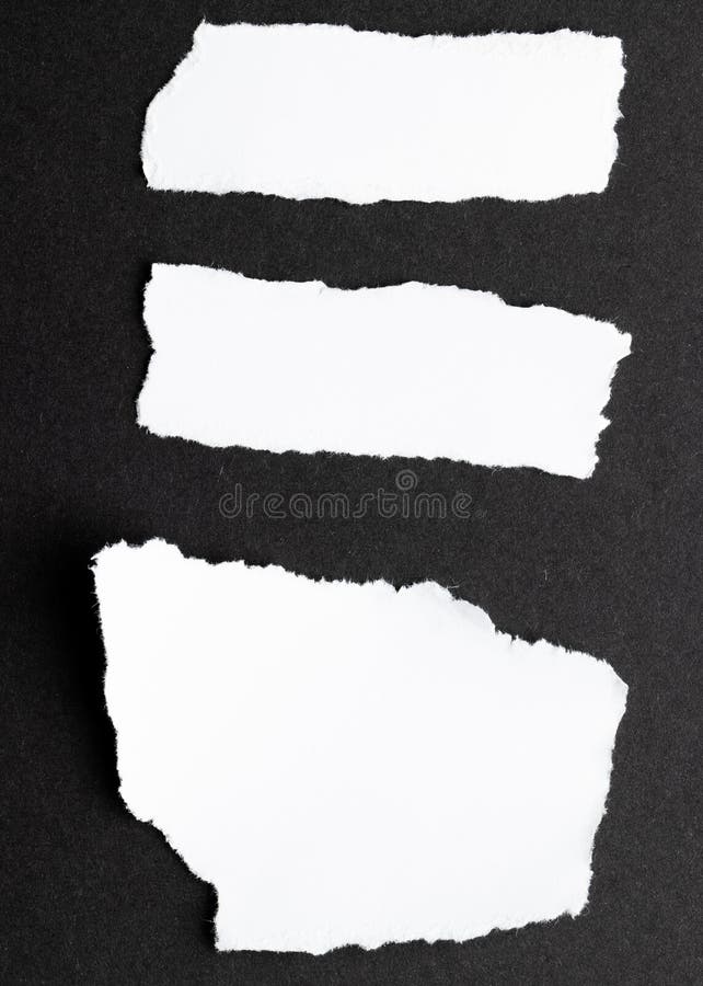 Ripped Up Pieces of White Paper with Copy Space on Black Background ...
