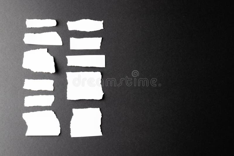 Ripped Up Pieces of White Paper with Copy Space on Black Background ...