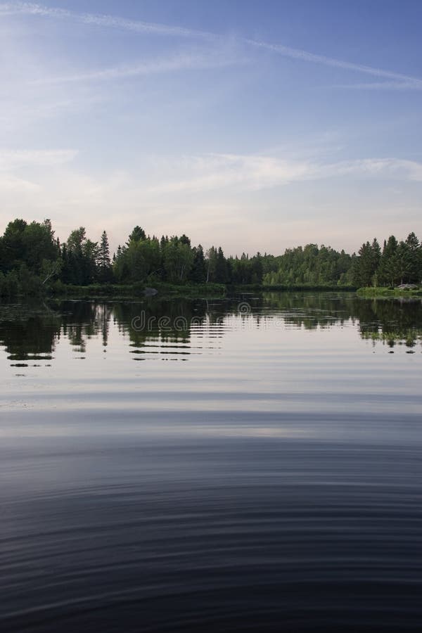 Ripple in a lake stock image. Image of water, tree, cottage - 10741541
