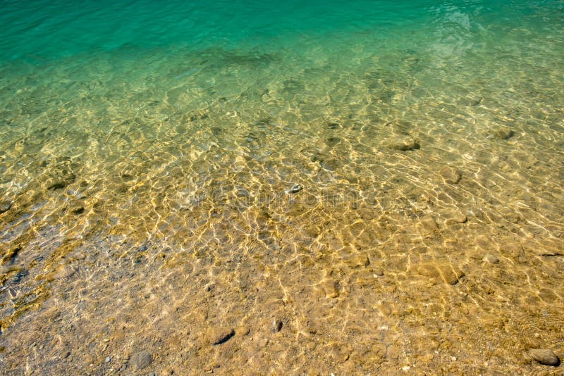 Ripple Water Abstract Background with Small Pebbles Stock Photo - Image ...
