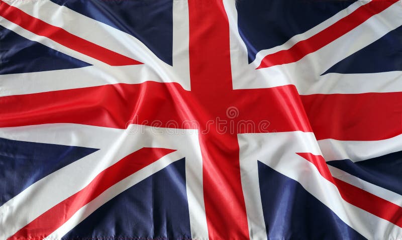 Closeup of Union Jack Flag. UK Flag. British Union Jack Flag Blowing in ...