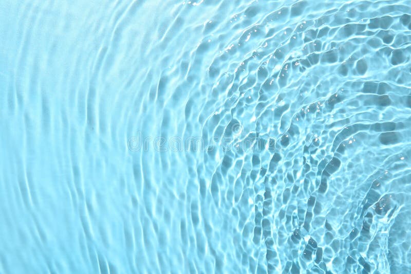 Rippled Surface of Clear Water on Light Blue Background, Closeup Stock ...