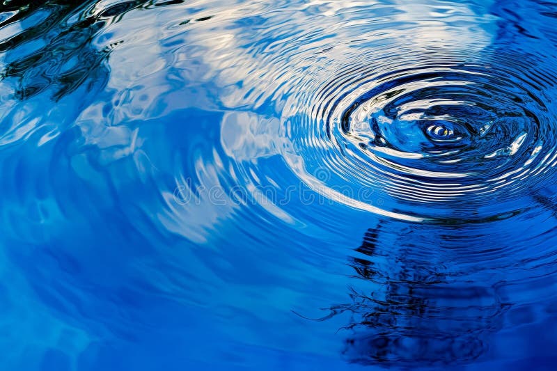 Ripples Dance Gracefully on the Surface of Deep Blue Water, Mirroring ...