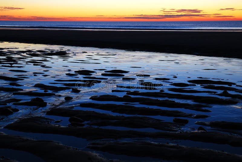 Ripples at sunrise stock photo. Image of destination - 130852714