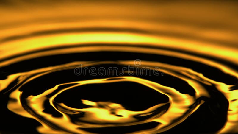 Ripples on the Surface of Golden Liquid Oil with Waves Creating ...