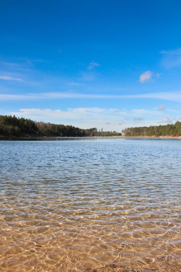 Ripples on Water Surface. Clear Shimmering Water and View at Its Bottom ...