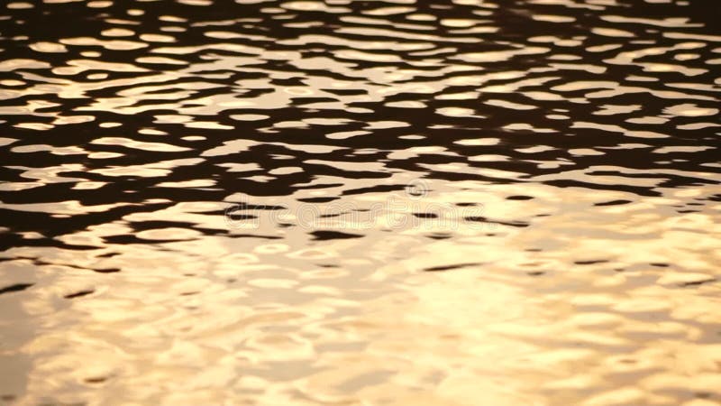 Ripples on Water Surface with the Reflection of Sky and Clouds. Clouds ...