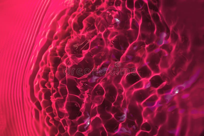 Ripples on the Water , Viva Magenta Color of the Year 2023 Stock Photo ...
