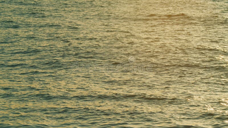 Ripples and Waves on Water Surface. Reflection of Sunlight Over Sea ...